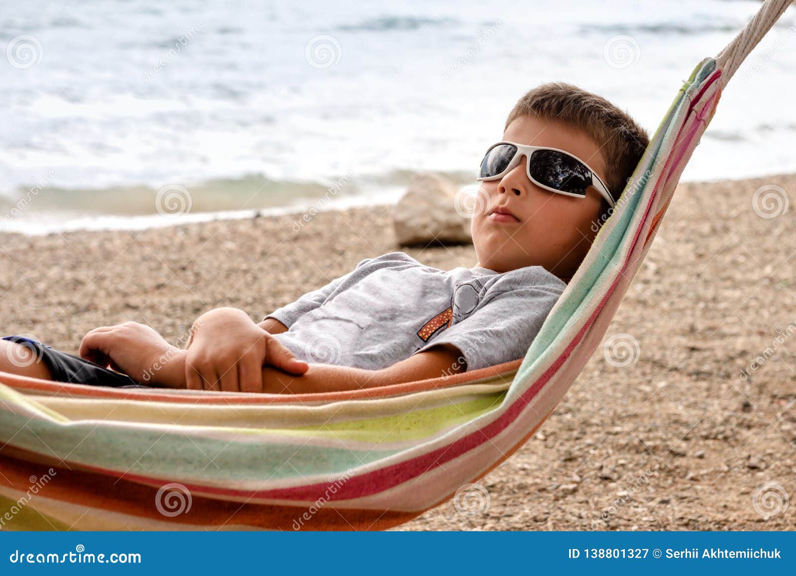 The Boy is Chafing Away on a Hammock by the Sea Stock Image - Image of ...