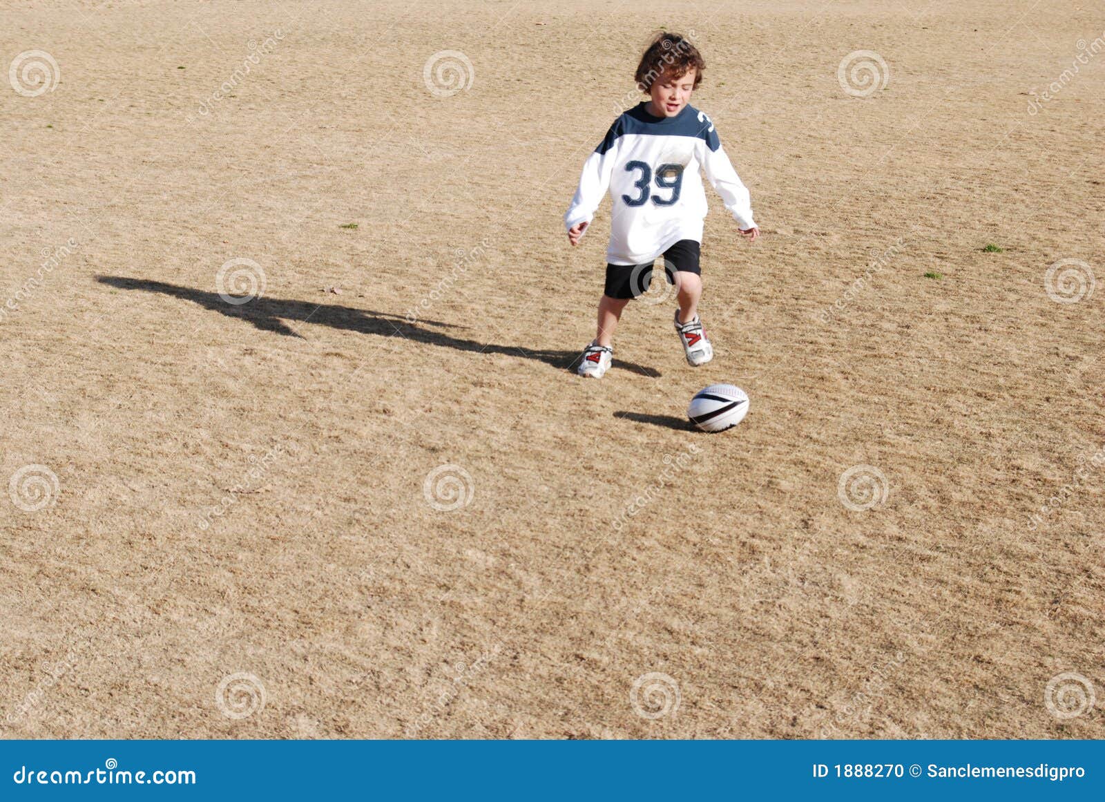 Boy chasing football stock photo. Image of hair, running - 1888270