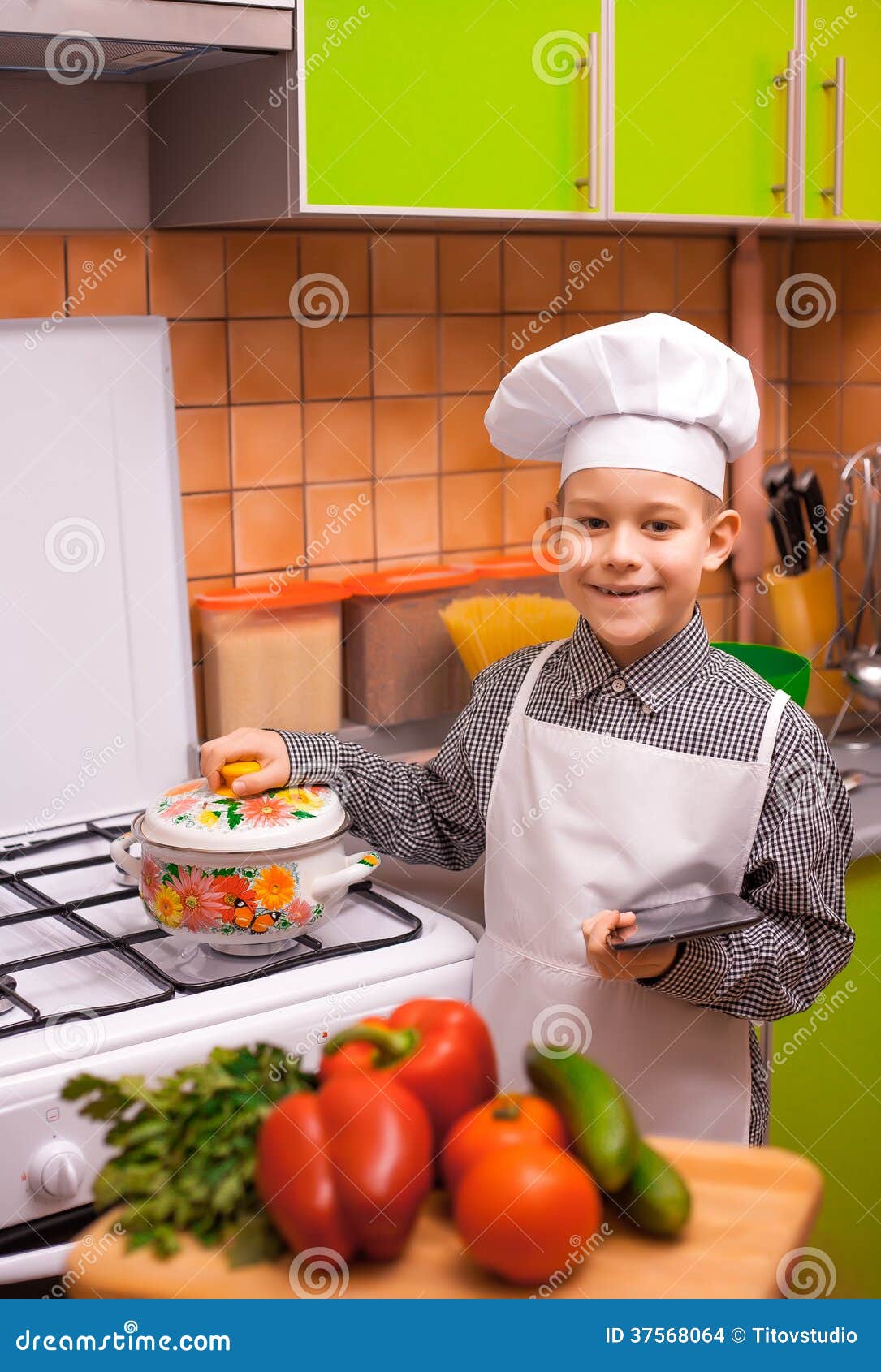 Boy Chef is Cooking on the Kitchen Stock Photo - Image of food, stove ...