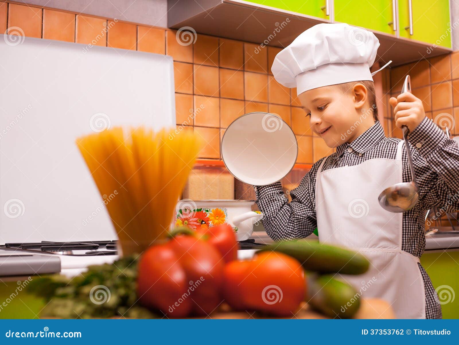 Boy Chef is Cooking in the Kitchen Stock Photo - Image of kitchen, chef ...