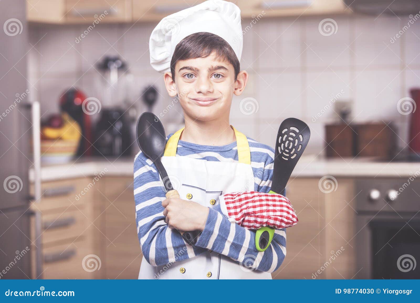 Boy chef in the kitchen stock photo. Image of children - 98774030