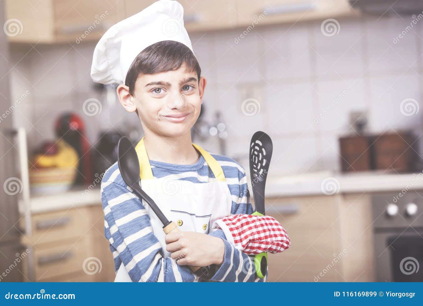 Boy chef in the kitchen stock image. Image of child - 116169899
