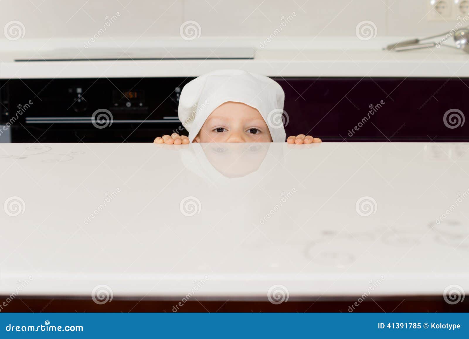 Boy in a Chefs Hat Peering Over the Counter Stock Image - Image of ...