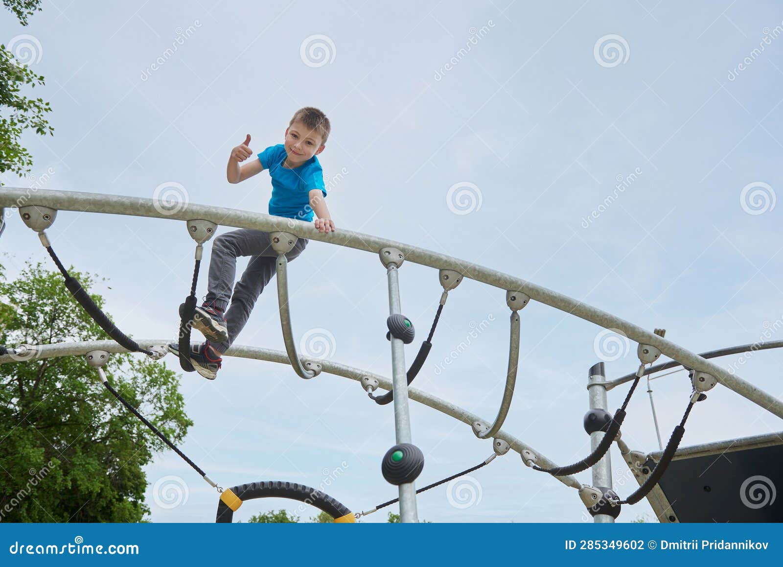 A Boy Child Having Fun Daring Climbs the Playground Stock Photo - Image ...