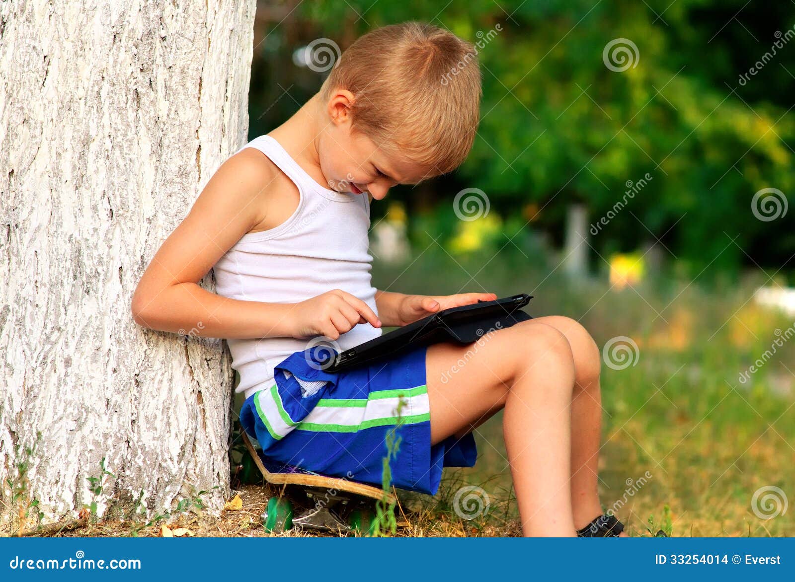 Boy Child Playing with Tablet PC Outdoor Stock Photo - Image of ...