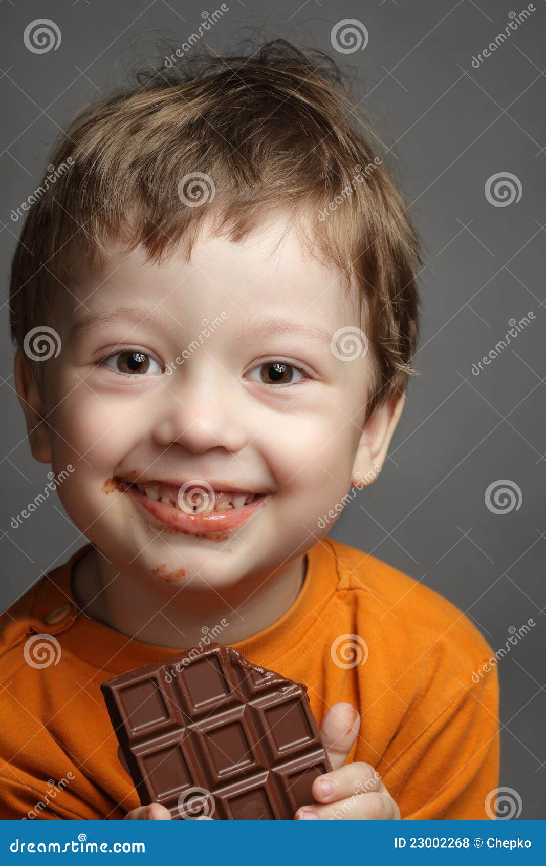 Boy with chocolate stock photo. Image of indulgence, shot - 23002268