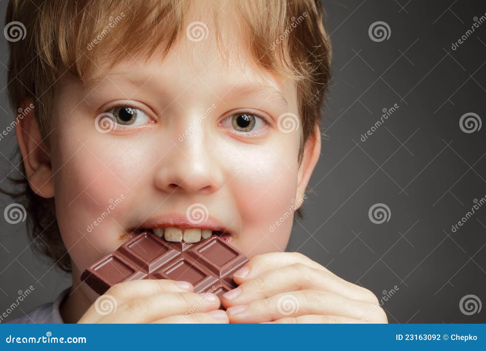 Boy with chocolate stock photo. Image of cross, closeup - 23163092