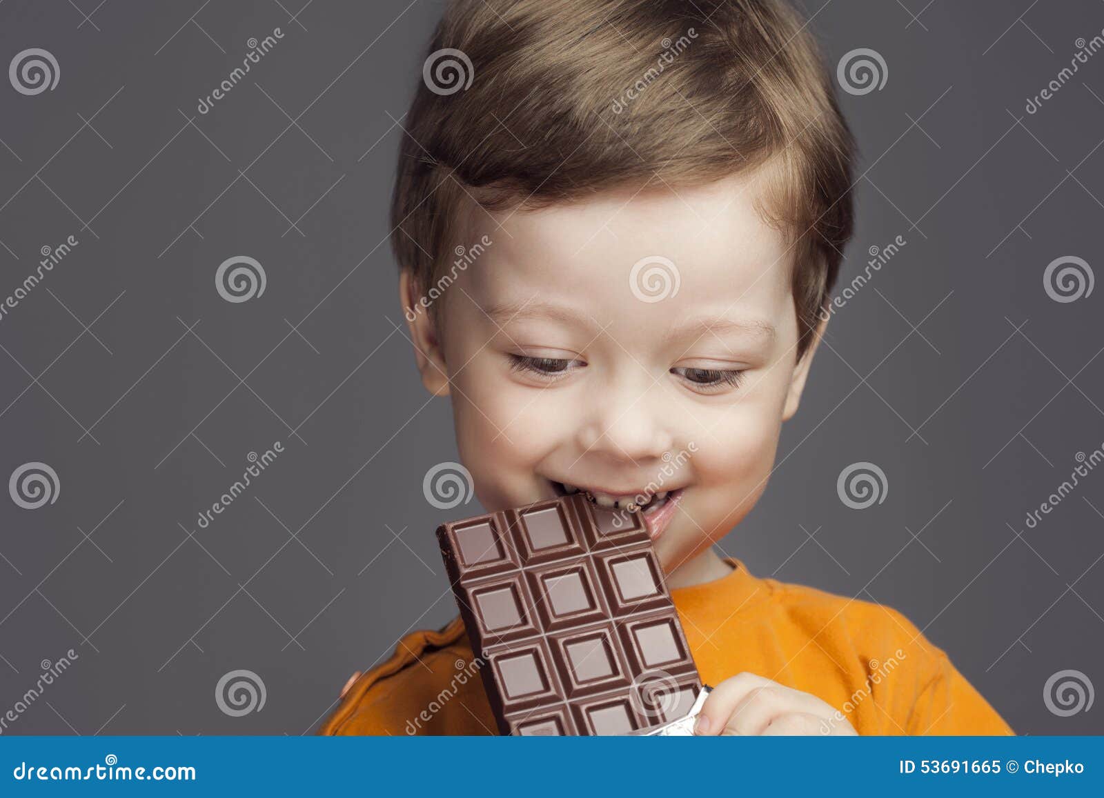 Boy with chocolate bar stock image. Image of eating, human - 53691665
