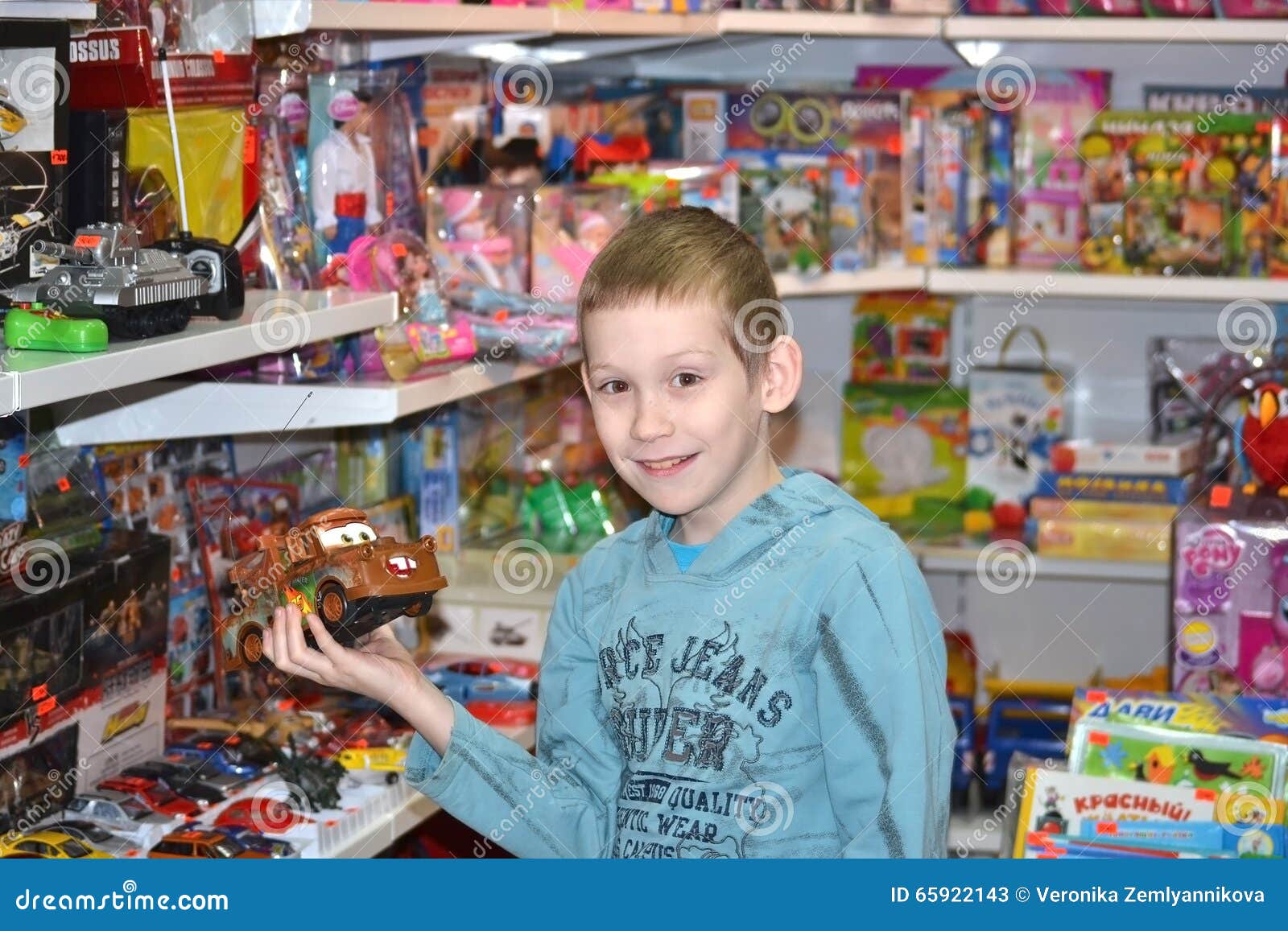 The Boy Chooses a Toy in Toy Store. Editorial Stock Photo - Image of ...