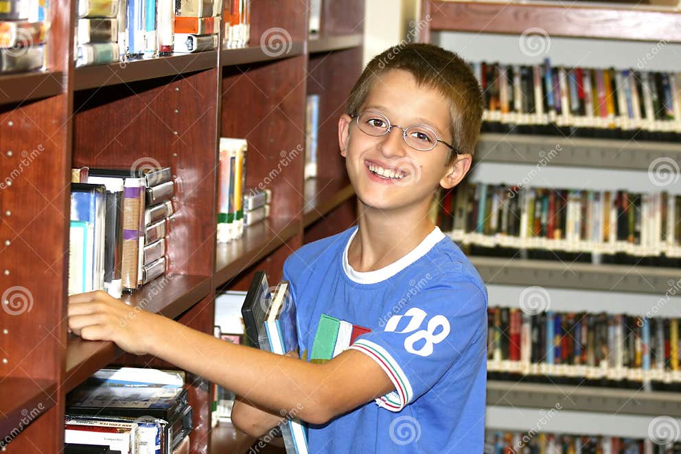 Boy choosing a book stock photo. Image of book, student - 5831932