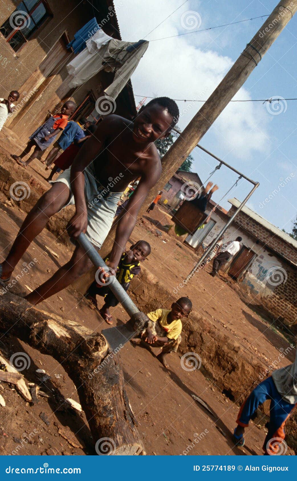 A Boy Chopping Wood, Uganda Editorial Stock Image - Image of people ...