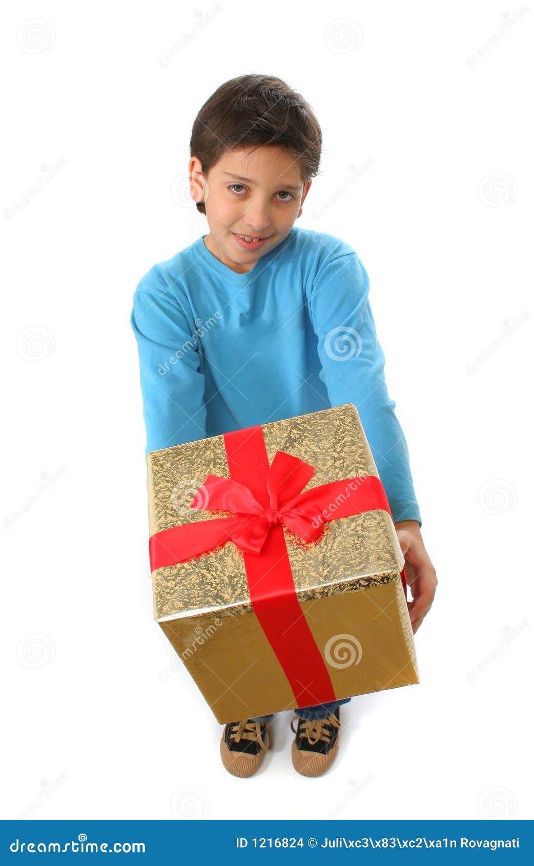 Boy with a christmas gift stock photo. Image of gold, present - 1216824