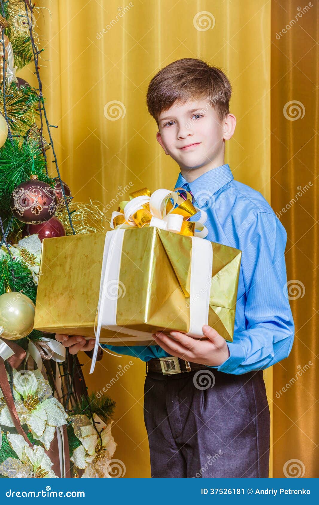 Boy with Christmas gift stock image. Image of decorations - 37526181