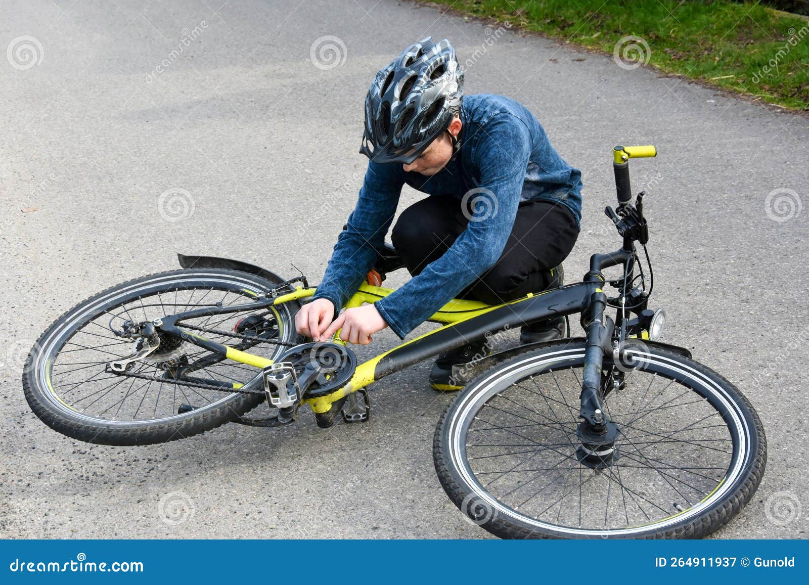 Boy Squatting on the Floor and Checks His Bike Stock Image - Image of ...