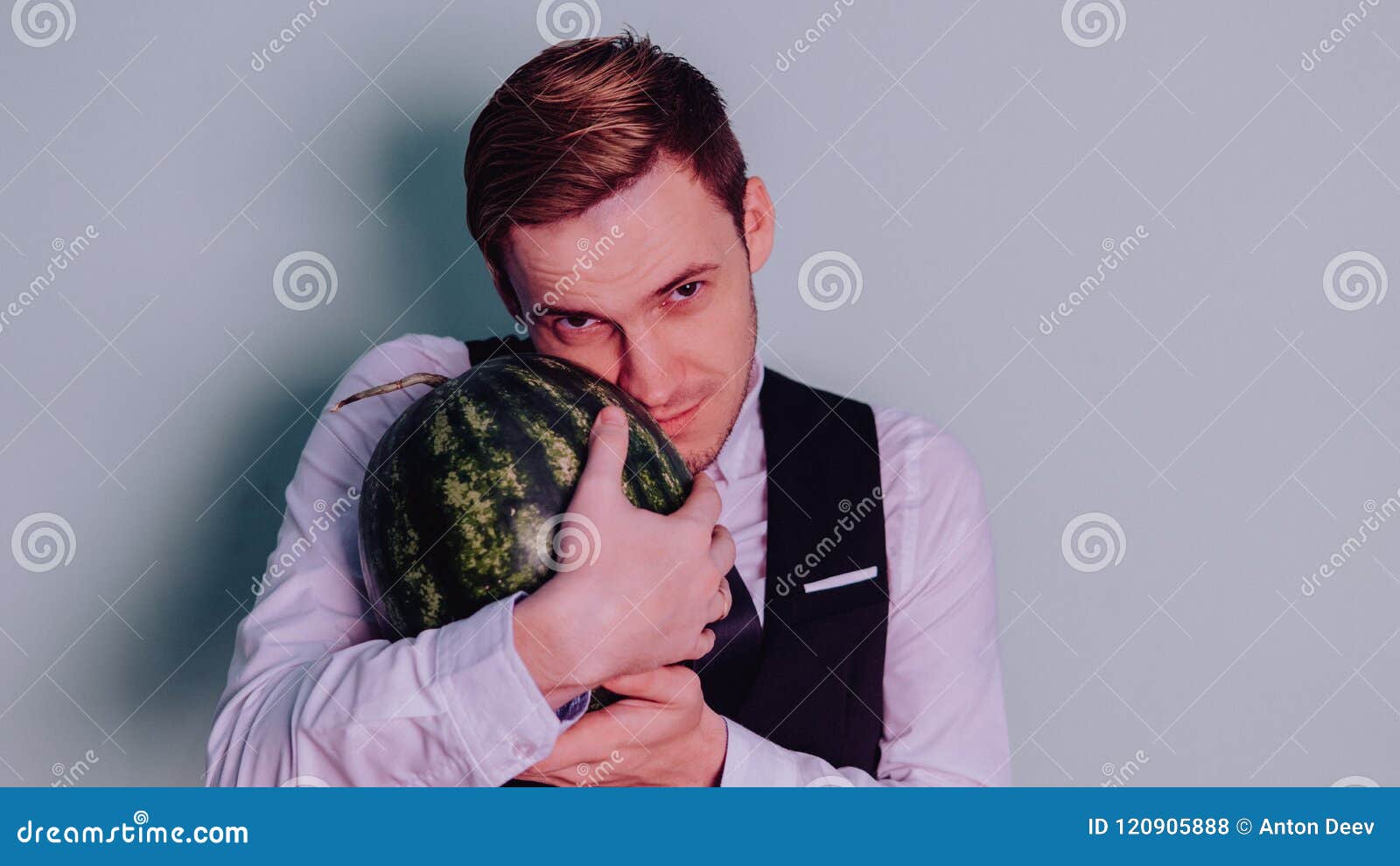 A Man and a Watermelon / Boy in Classic Suit with a Watermelon Stock ...