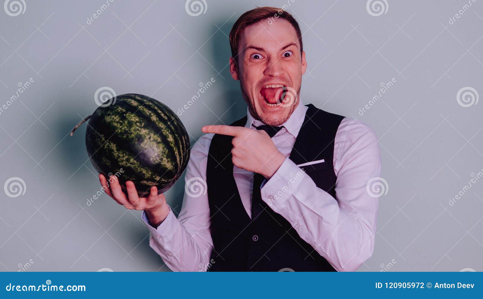 A Man and a Watermelon / Boy in Classic Suit with a Watermelon Stock ...