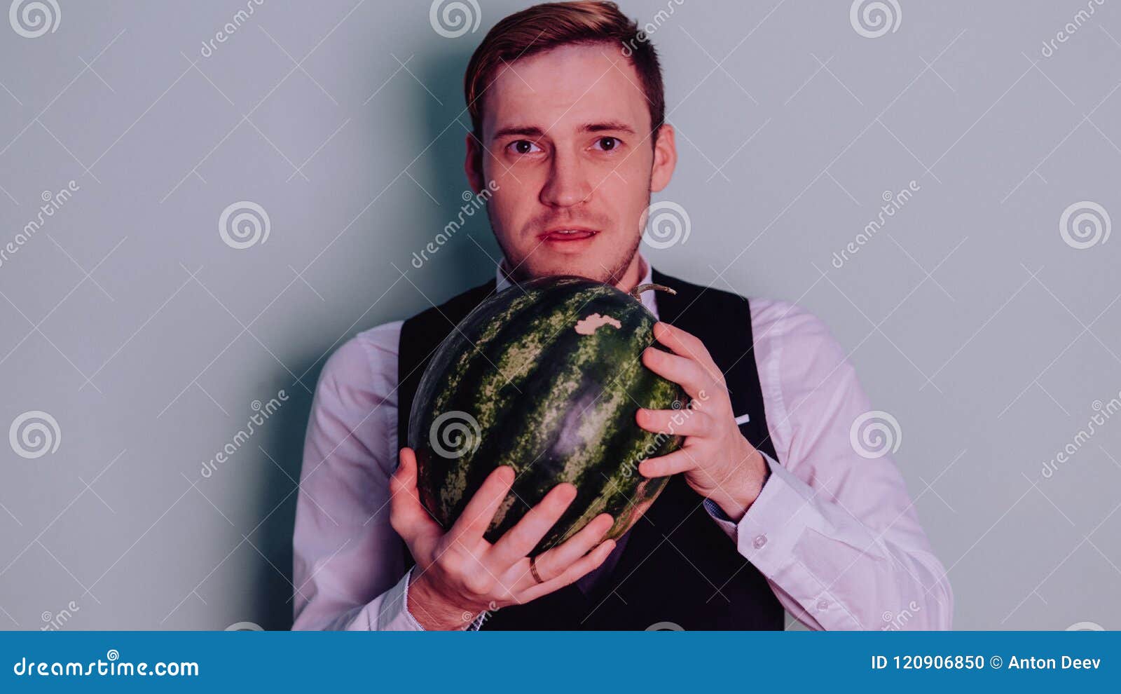 A Man and a Watermelon / Boy in Classic Suit with a Watermelon Stock ...