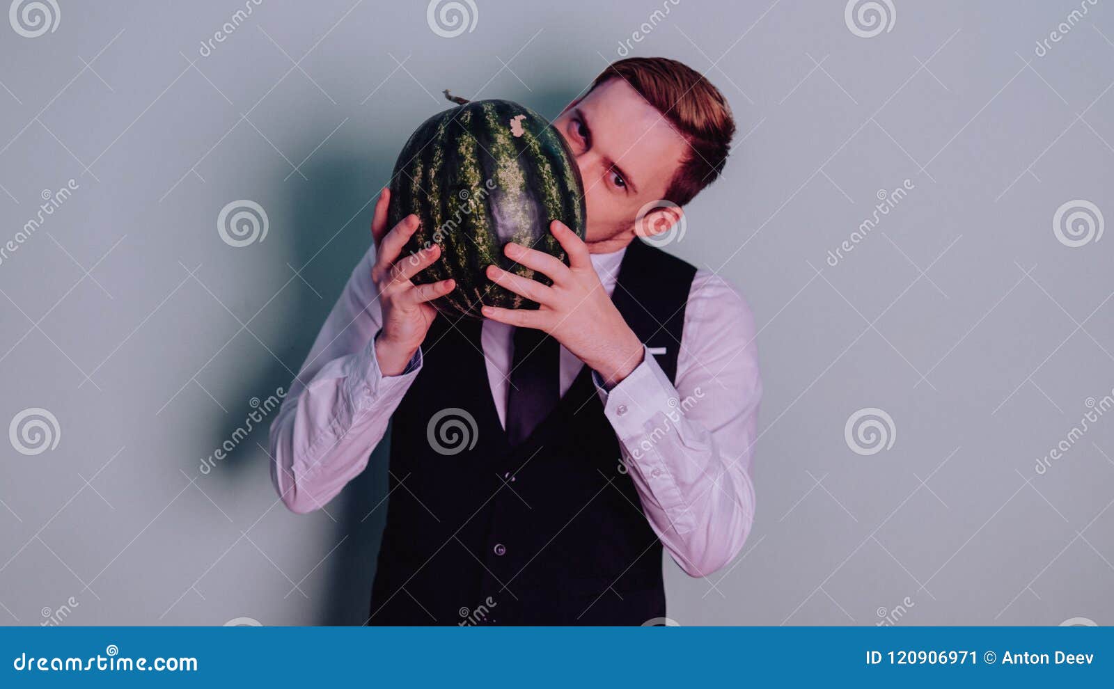 A Man and a Watermelon / Boy in Classic Suit with a Watermelon Stock ...