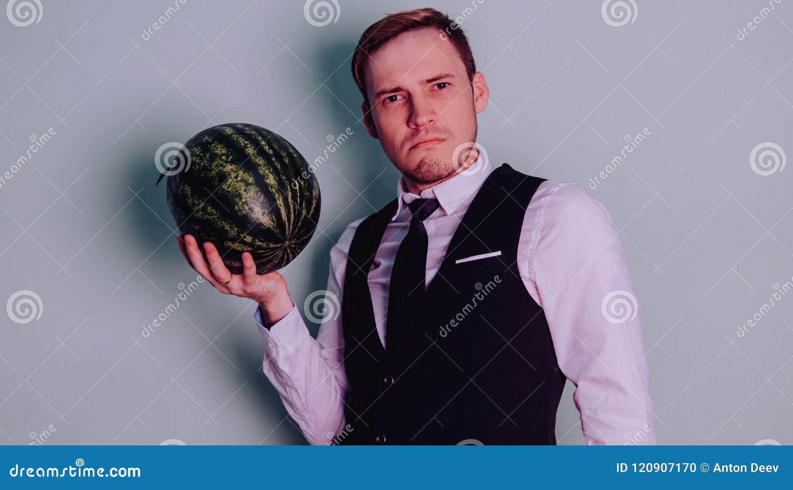 A Man and a Watermelon / Boy in Classic Suit with a Watermelon Stock ...