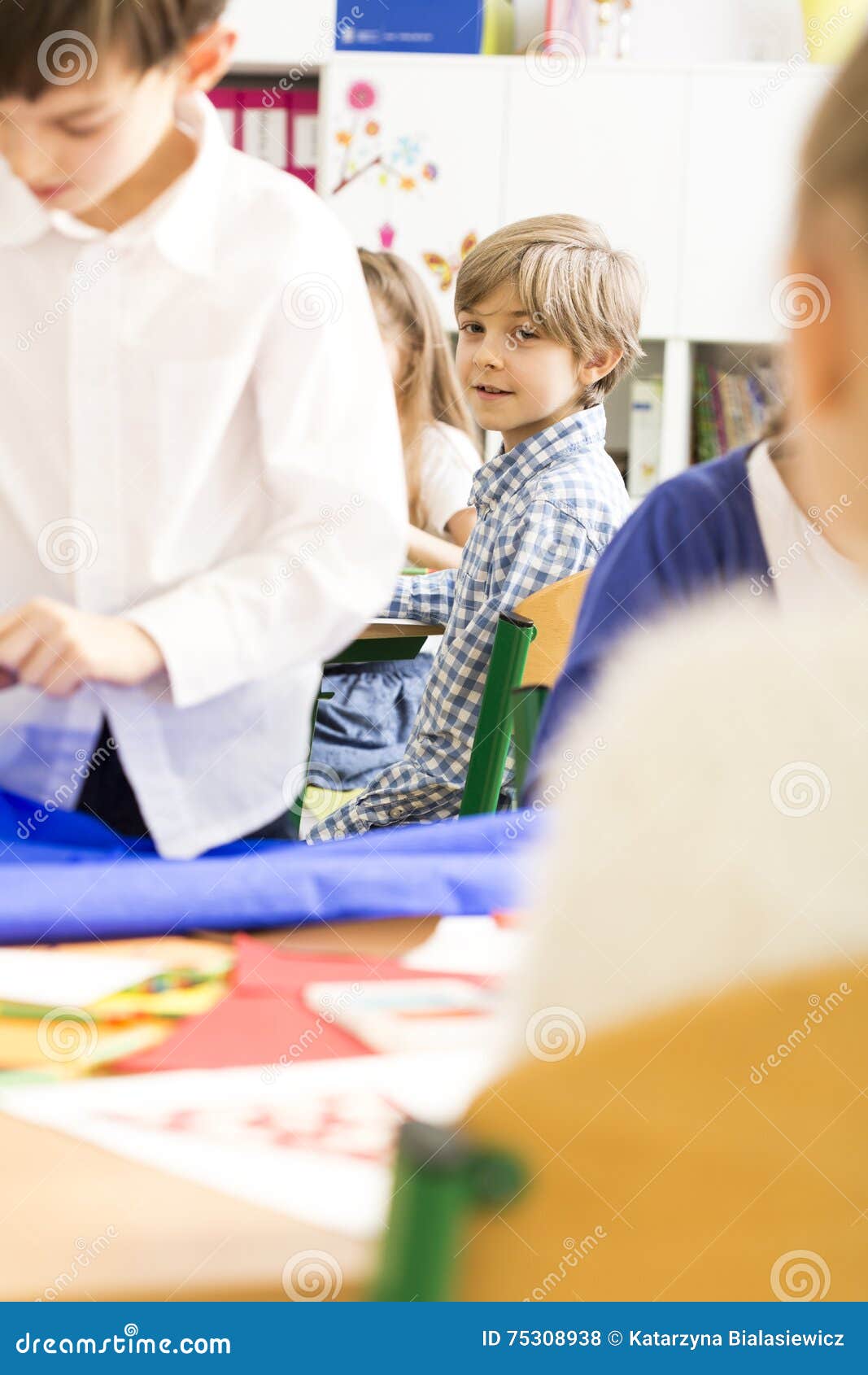 Boy in a classroom mess stock photo. Image of lesson - 75308938