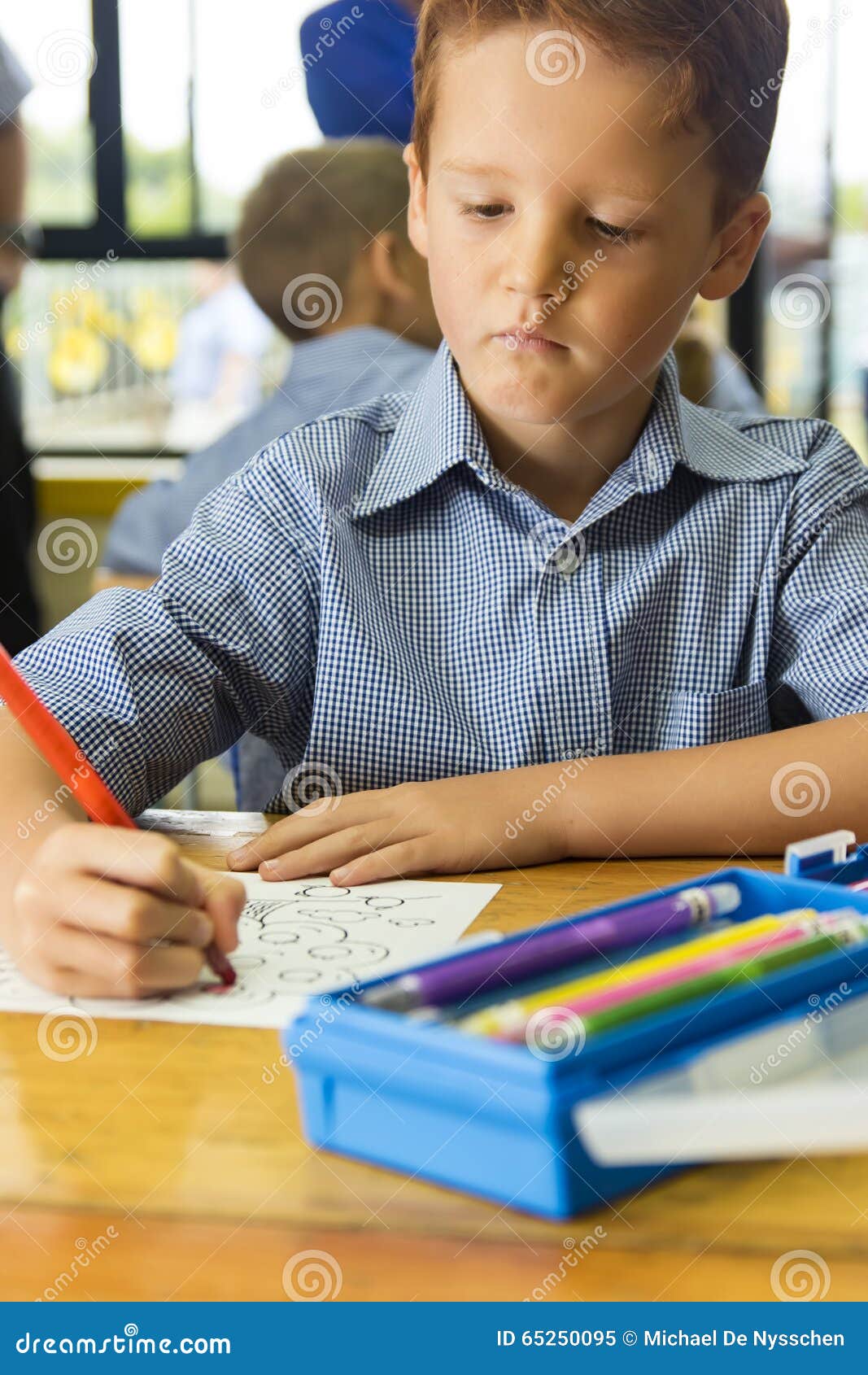 Boy in classroom working stock image. Image of classroom - 65250095