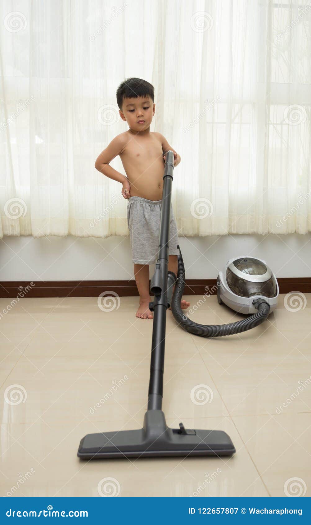 The Boy is Cleaning the Floor Stock Image - Image of vacuum, cleaning ...