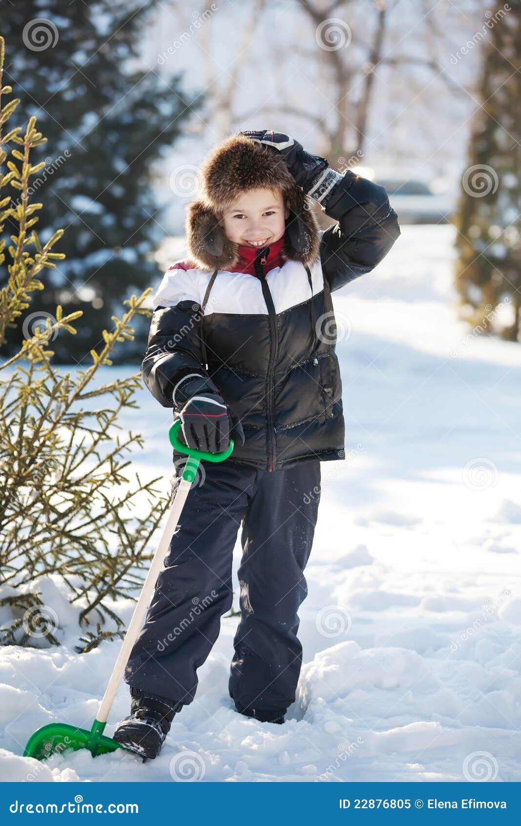 The boy cleans snow stock image. Image of jacket, shoveling - 22876805