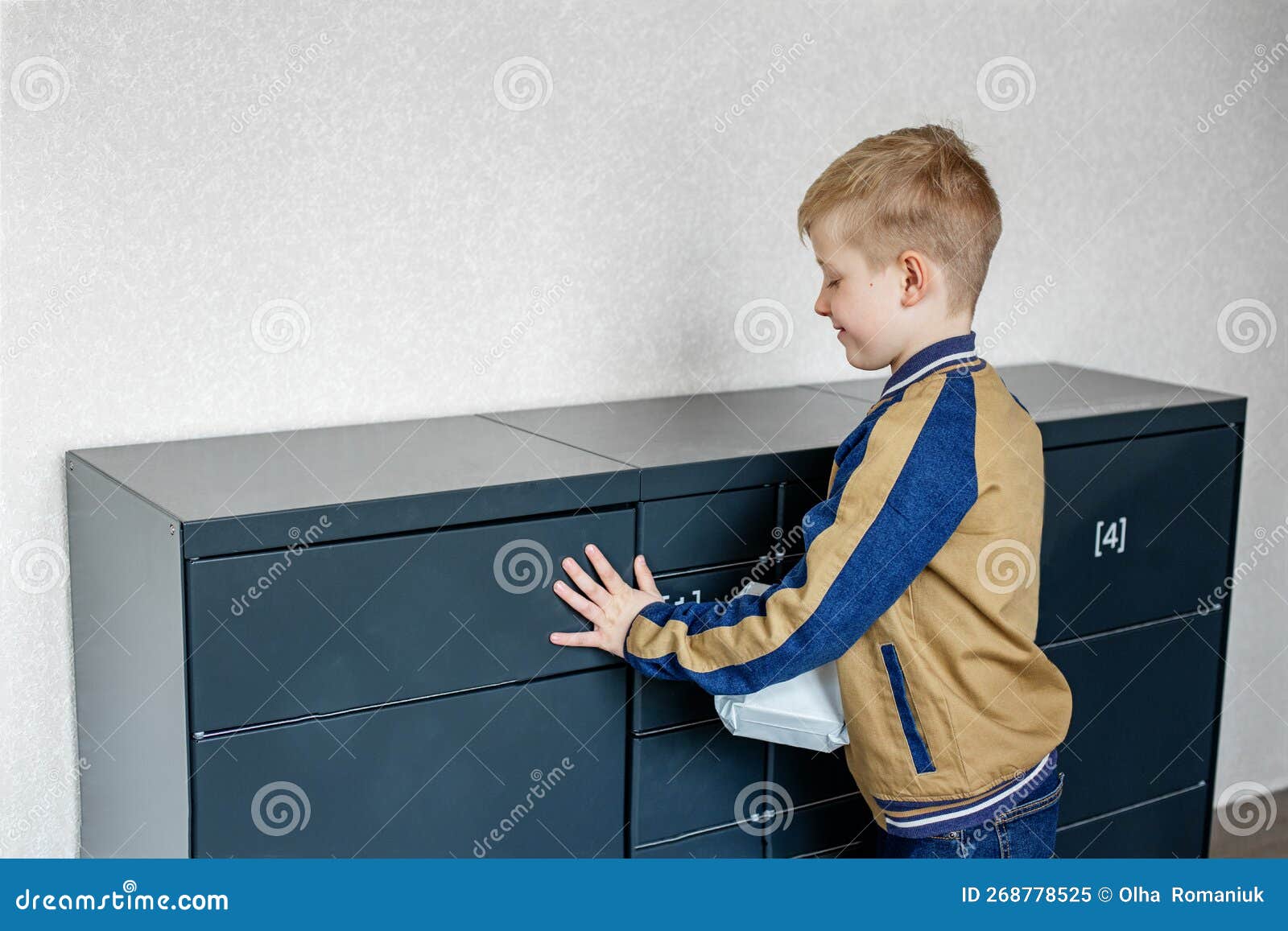 Boy Client Using Automated Self Service Post Terminal Machine or Locker ...