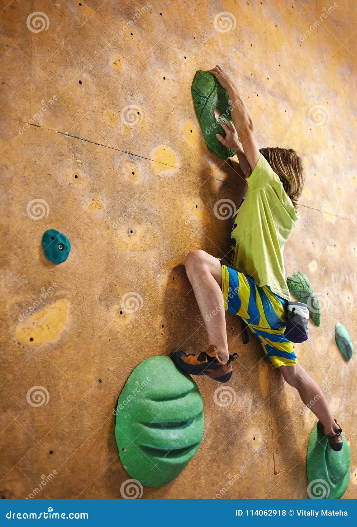 Boy climber climbs indoors stock photo. Image of equipment - 114062918