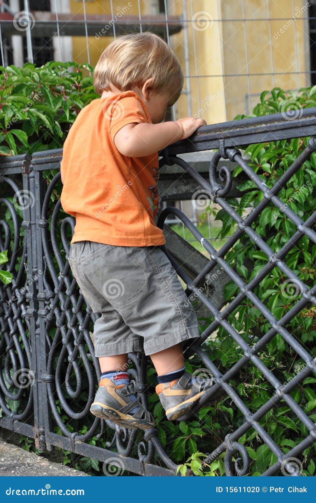 Boy climbing fence stock photo. Image of climb, overcome - 15611020