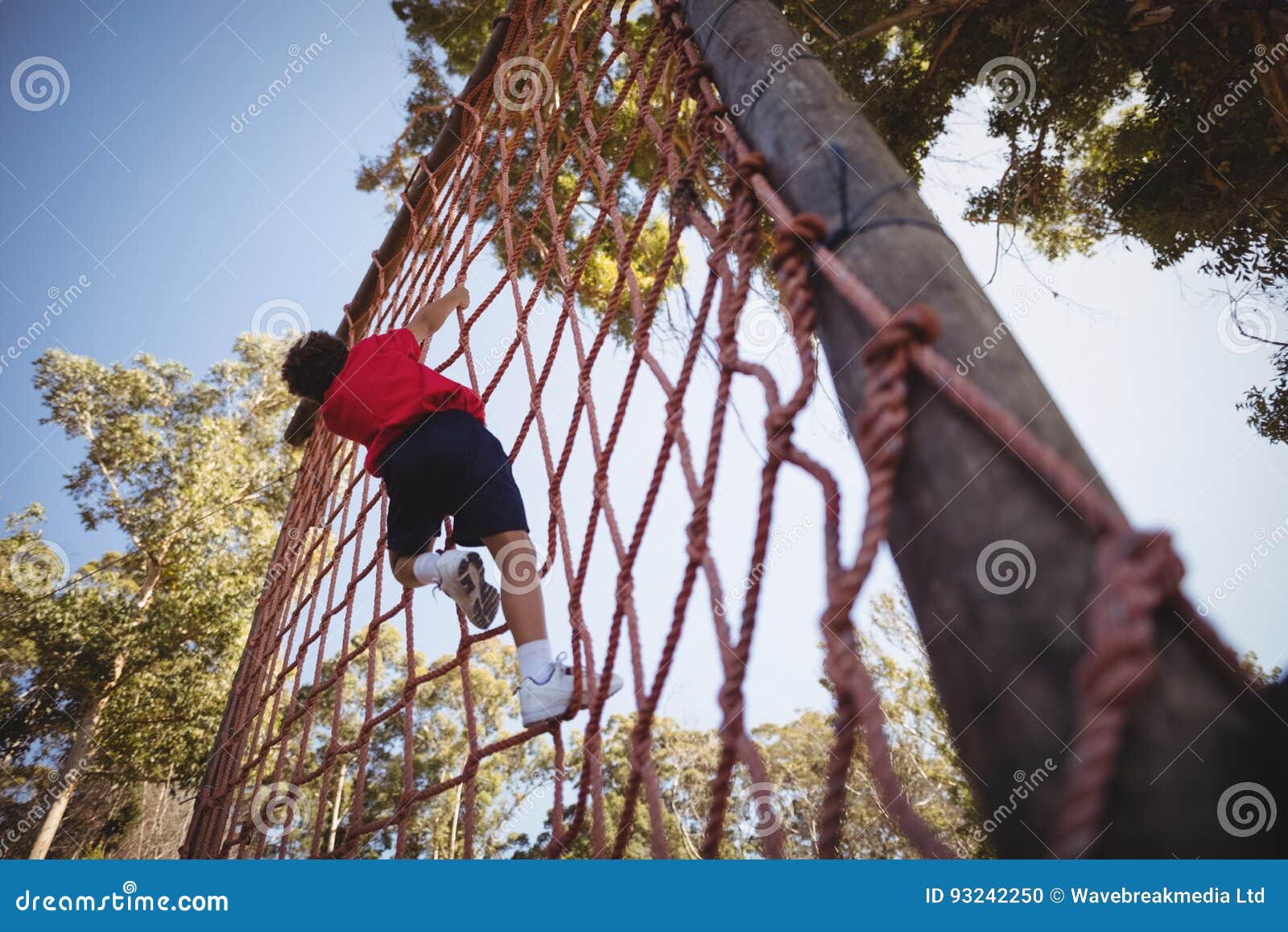 Boy Climbing a Net during Obstacle Course Stock Photo - Image of boot ...