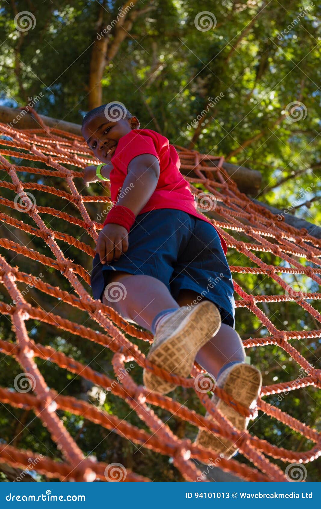 Boy Climbing a Net during Obstacle Course Training Stock Image - Image ...