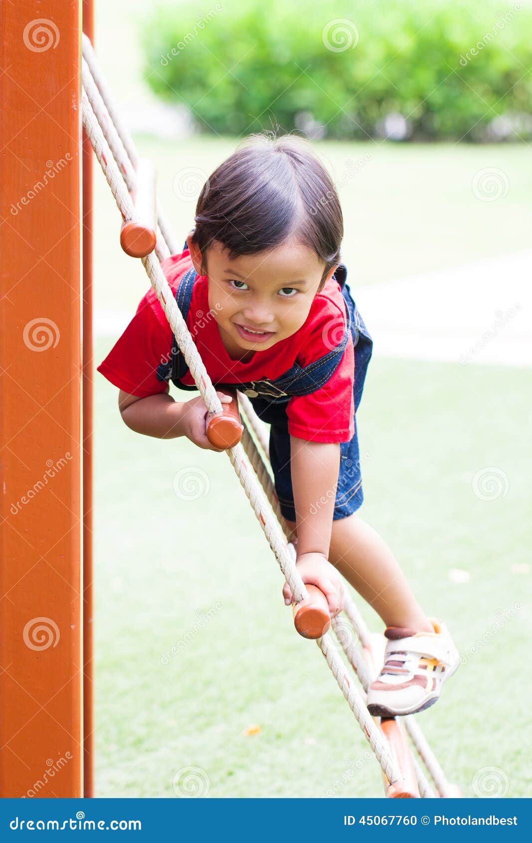 The boy climbing the net stock photo. Image of party - 45067760