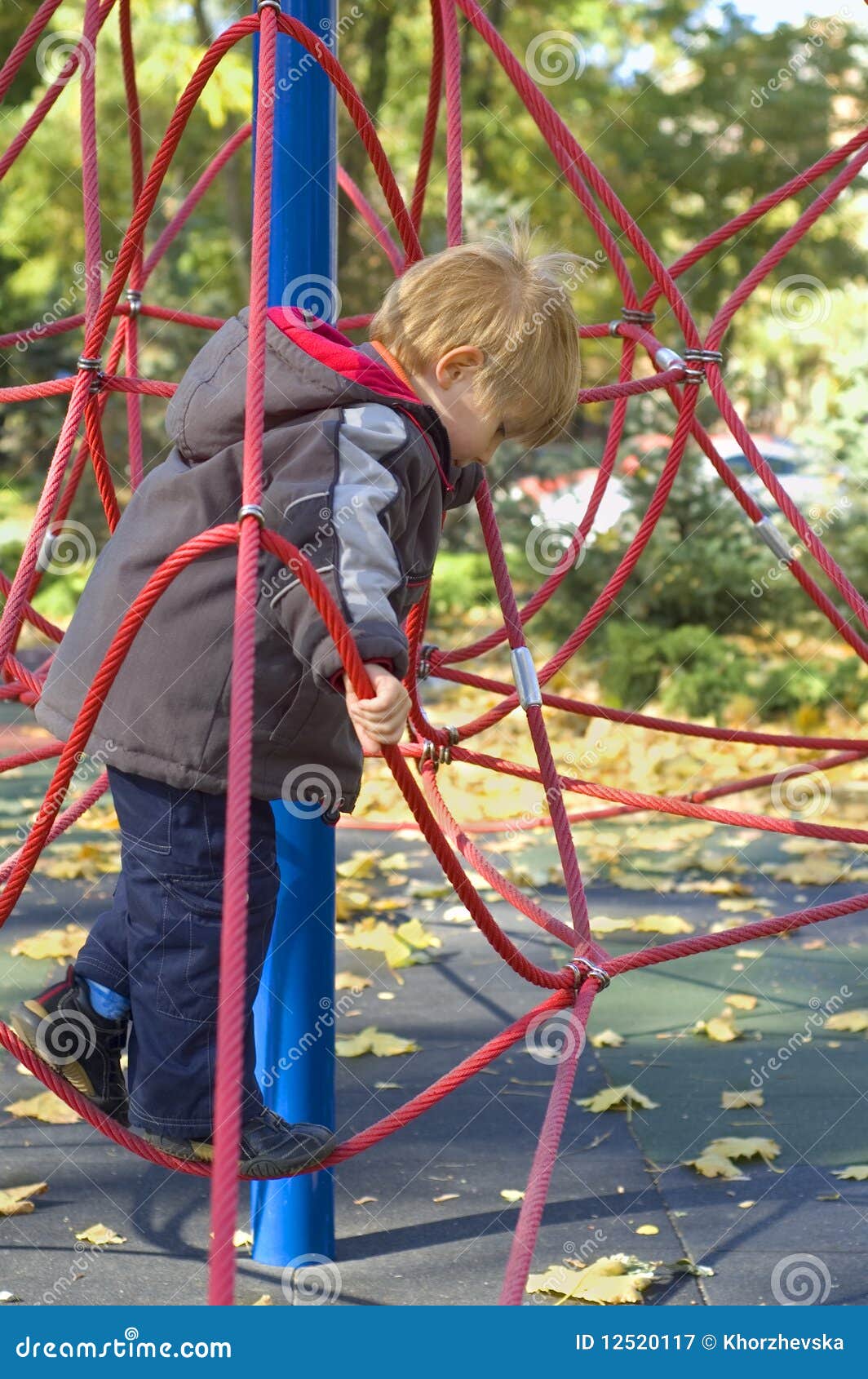 Boy climbing net of ropes stock image. Image of lifestyles - 12520117