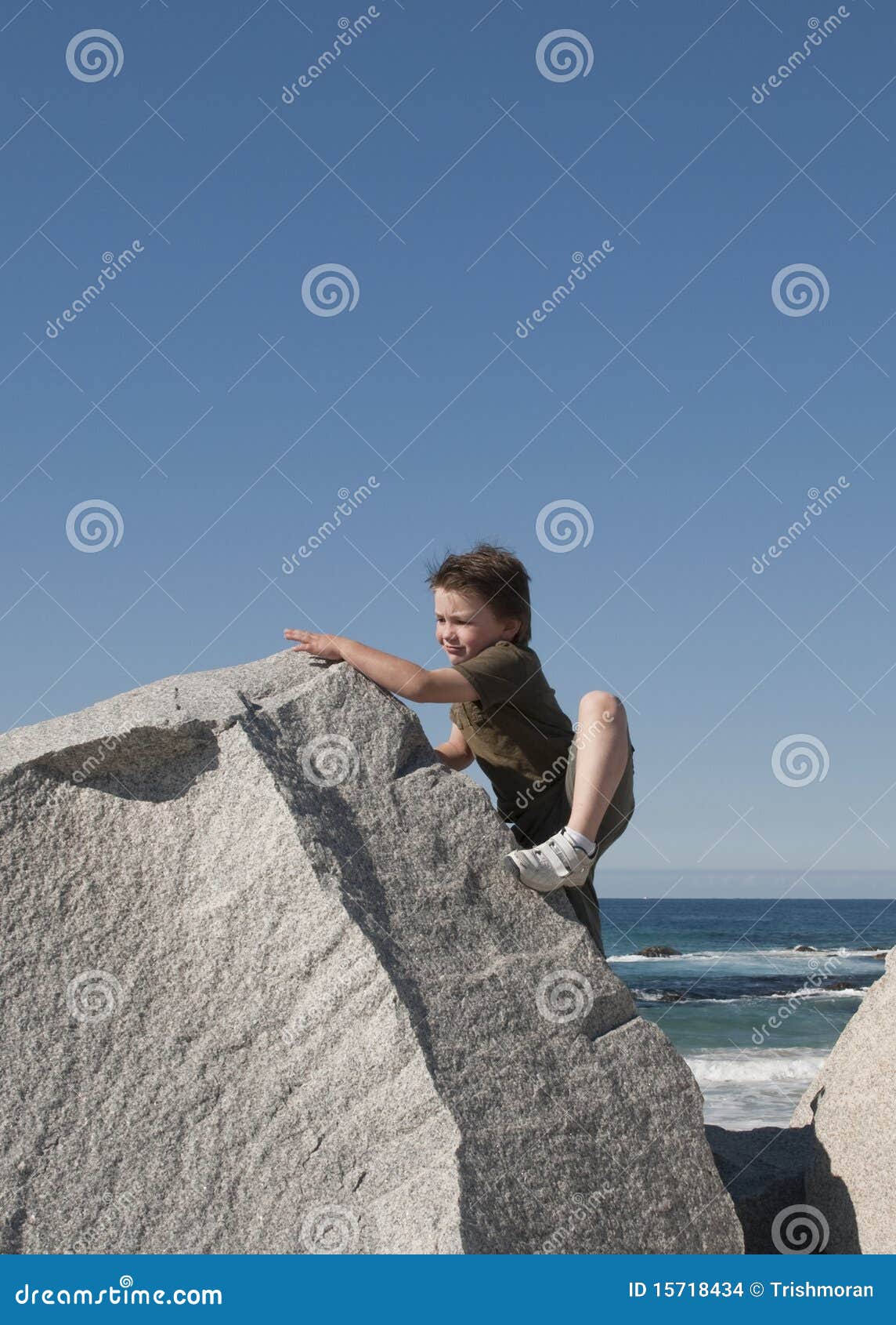 Boy Climbing Rock stock photo. Image of active, people - 15718434