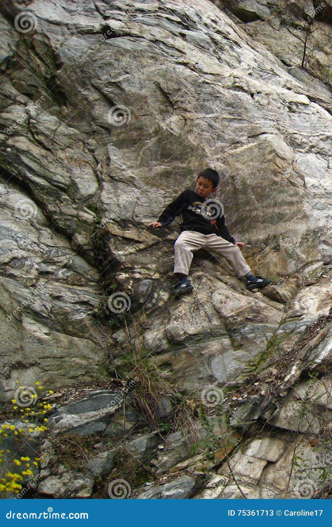 Boy Climbing the Rock stock image. Image of dangerous - 75361713