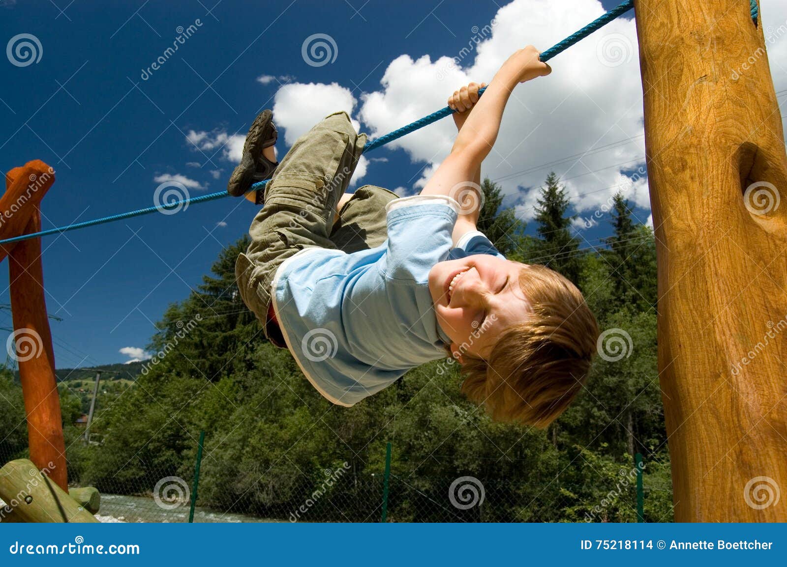 Boy on a climbing rope stock photo. Image of rope, climb - 75218114
