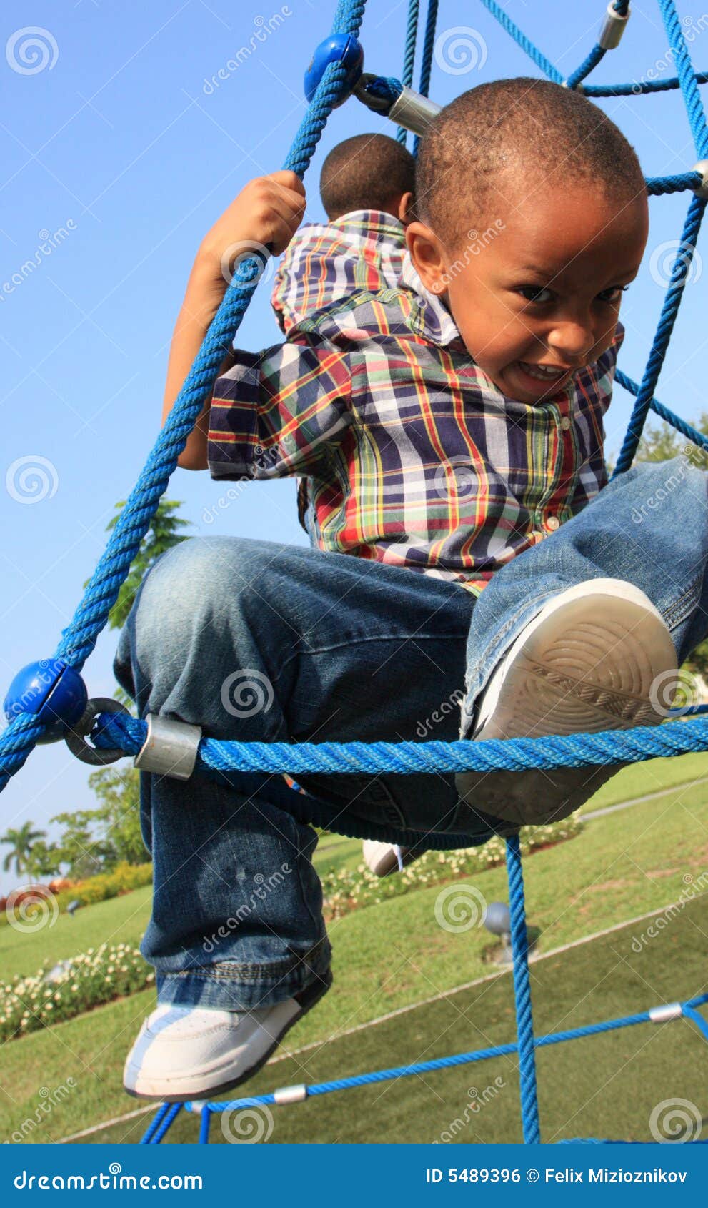 Boy Climbing Ropes stock photo. Image of outside, playing - 5489396