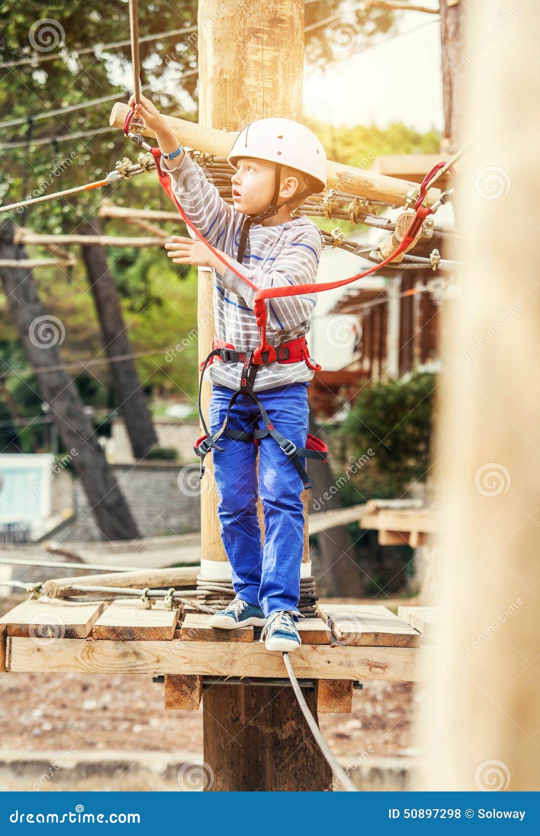 Boy Climbing on the Ropes in the Adrenaline Park Stock Photo - Image of ...