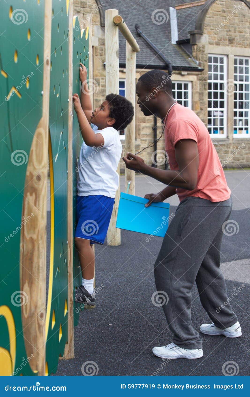 Boy on Climbing Wall in School Physical Education Class Stock Image ...