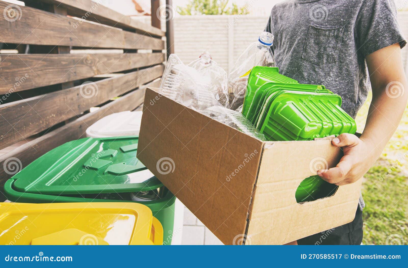 The Boy Collect the Plastic Trash into the Paper Box Stock Image ...