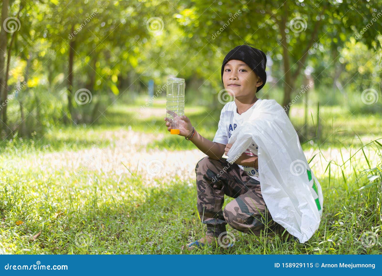 Boy Collecting Plastic Bottles in the Park Stock Image - Image of ...