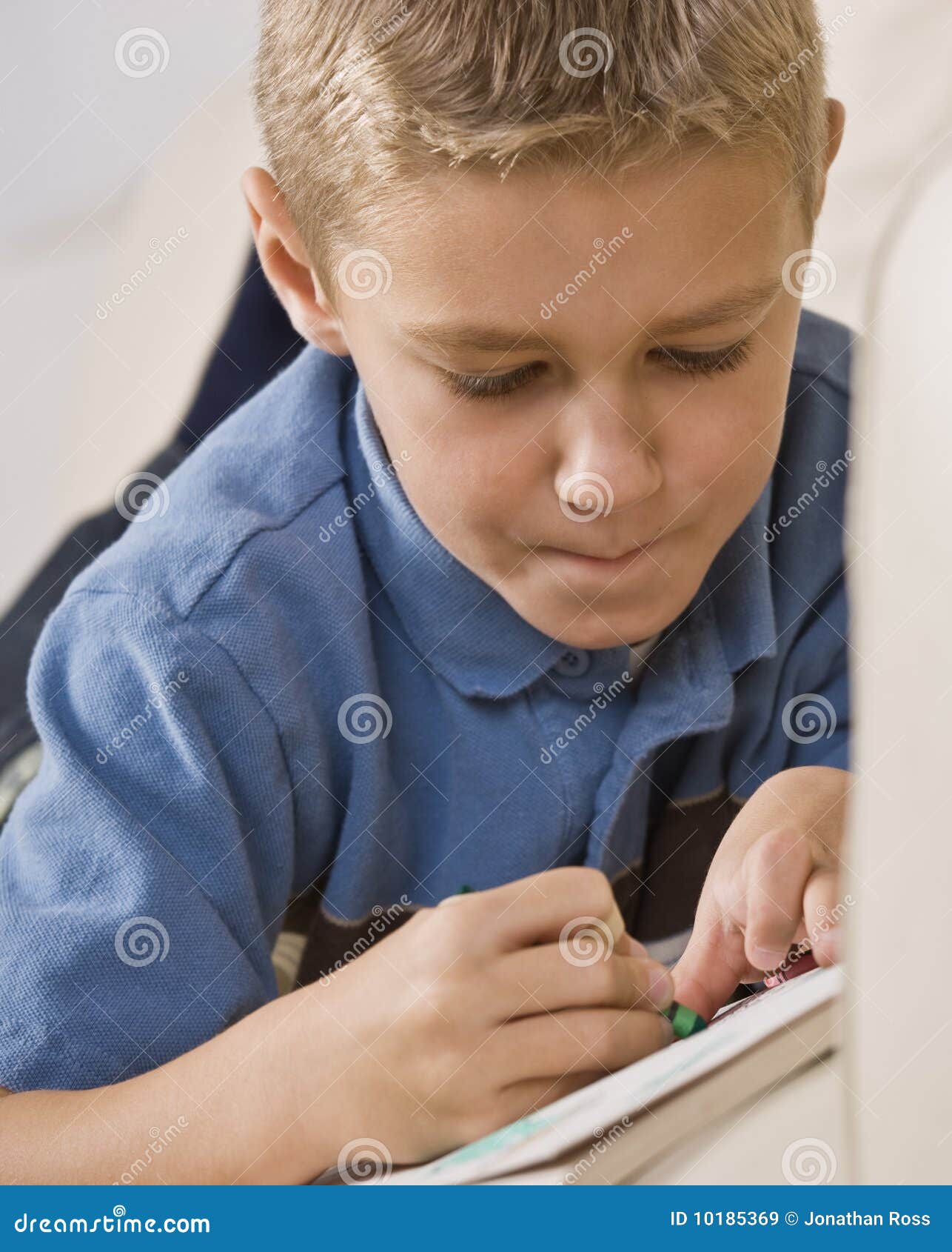 Boy Coloring In Book Royalty-Free Stock Photo | CartoonDealer.com #10185369