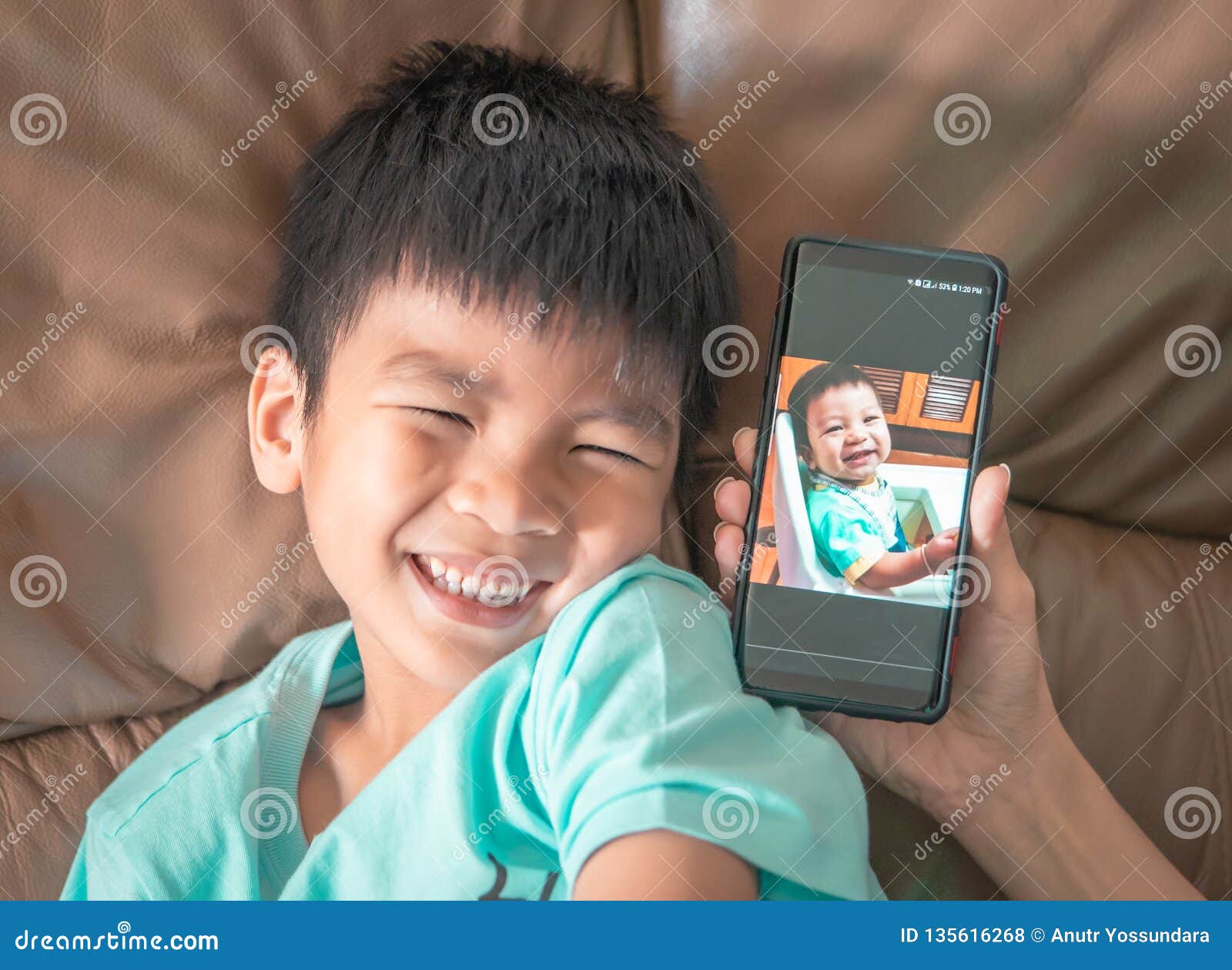 Boy Comparing with His Own Baby Picture Stock Photo - Image of baby ...