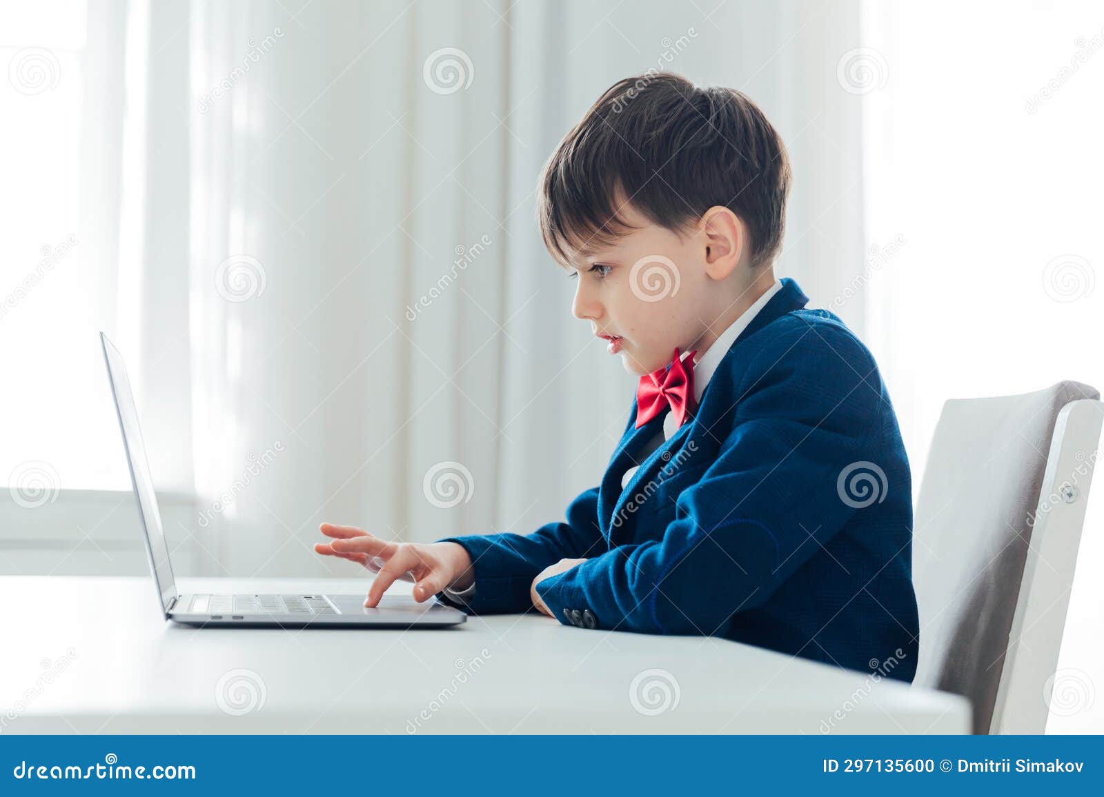 Boy at the Computer in the Classroom Learning Online Stock Photo ...
