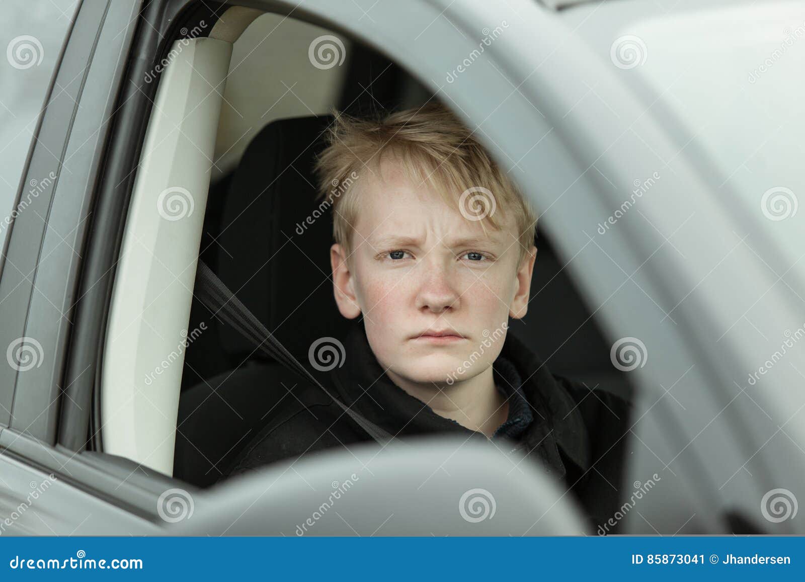 Boy with Concerned Expression Sitting Inside Car Stock Image - Image of ...