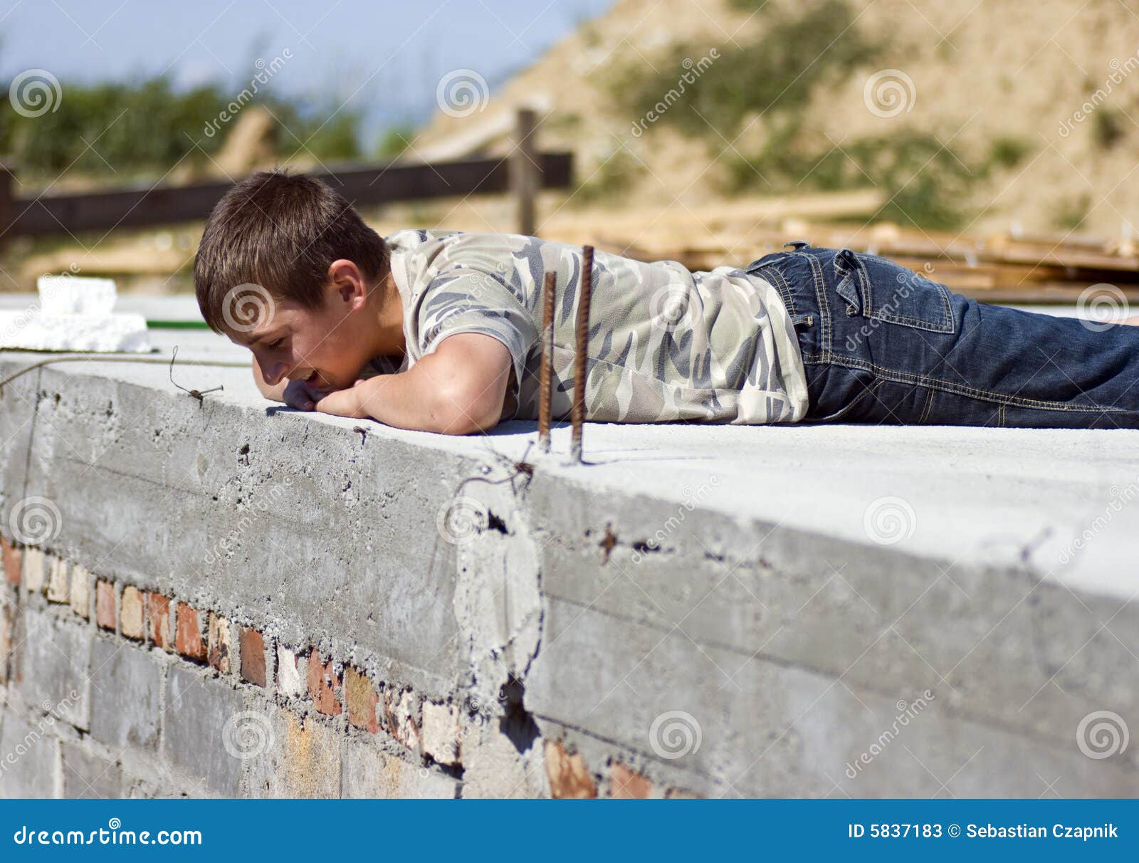 Boy on concrete building stock image. Image of teenager - 5837183