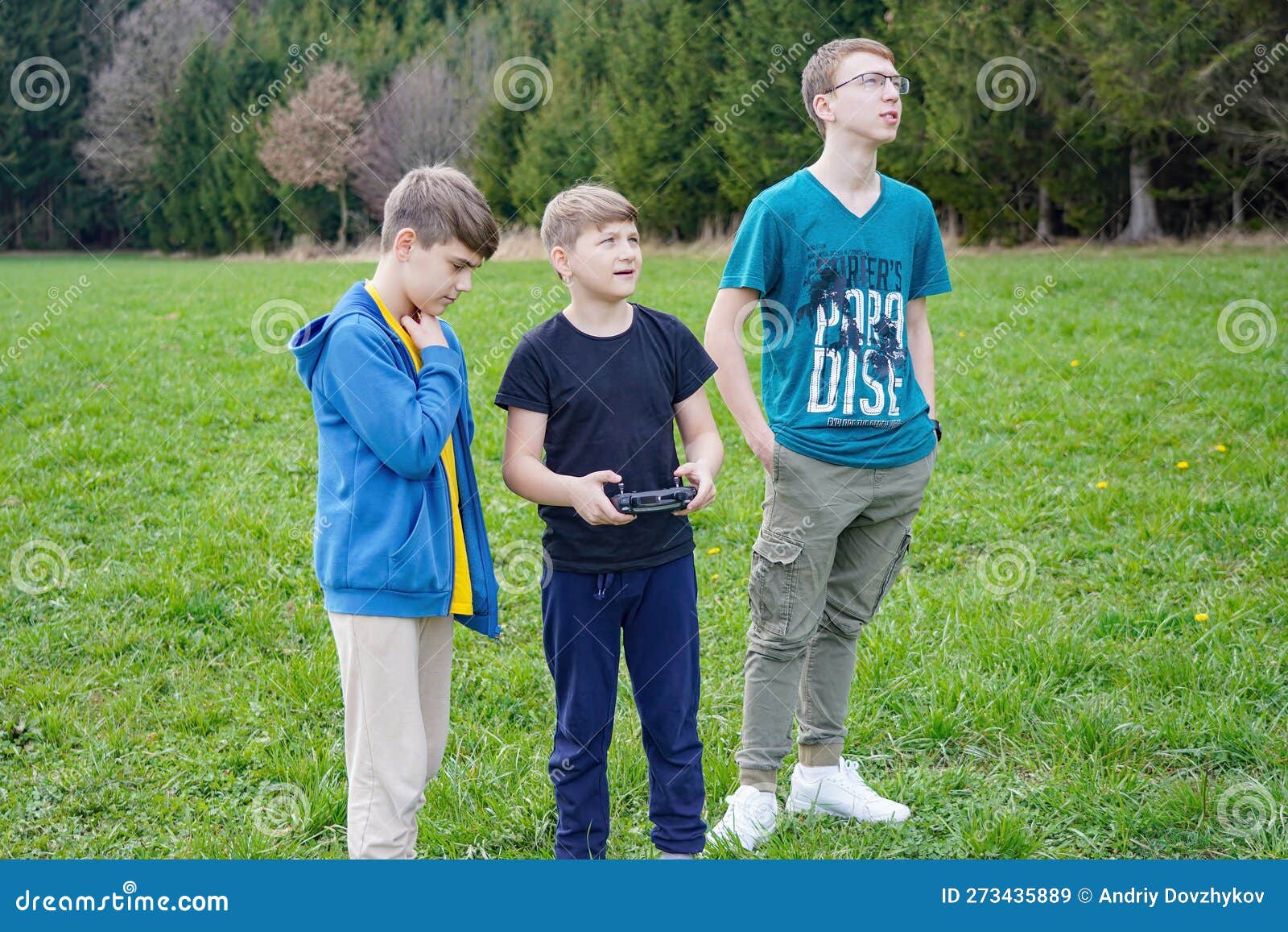 The Boy Controls the Flight of the Quadcopter Using the Remote Control ...