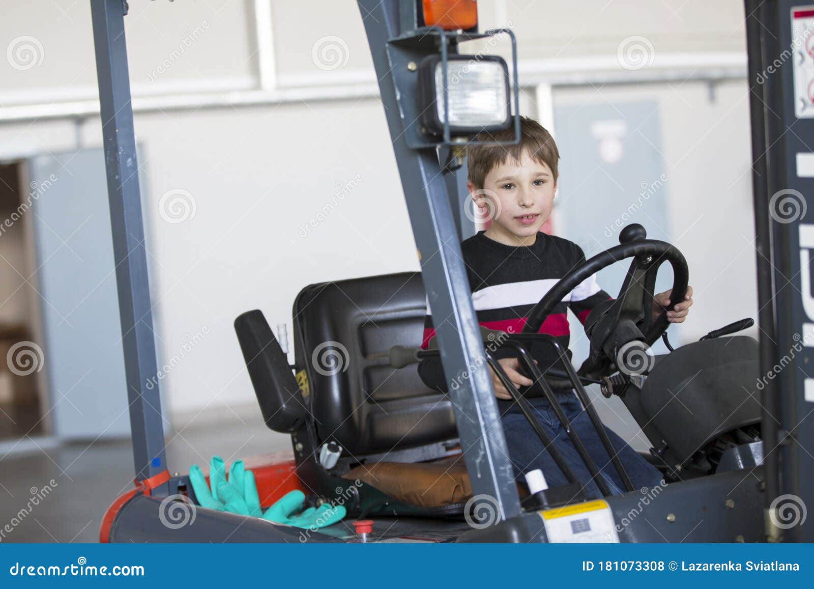 The Boy Controls the Loader. Stock Photo - Image of equipment, lift ...