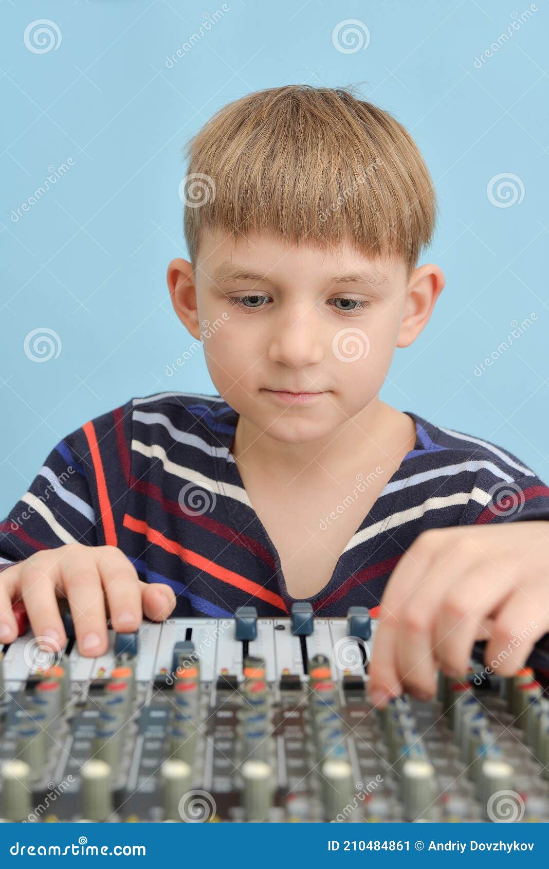 A Boy Controls a Mixing Console in a Music Studio Stock Image - Image ...